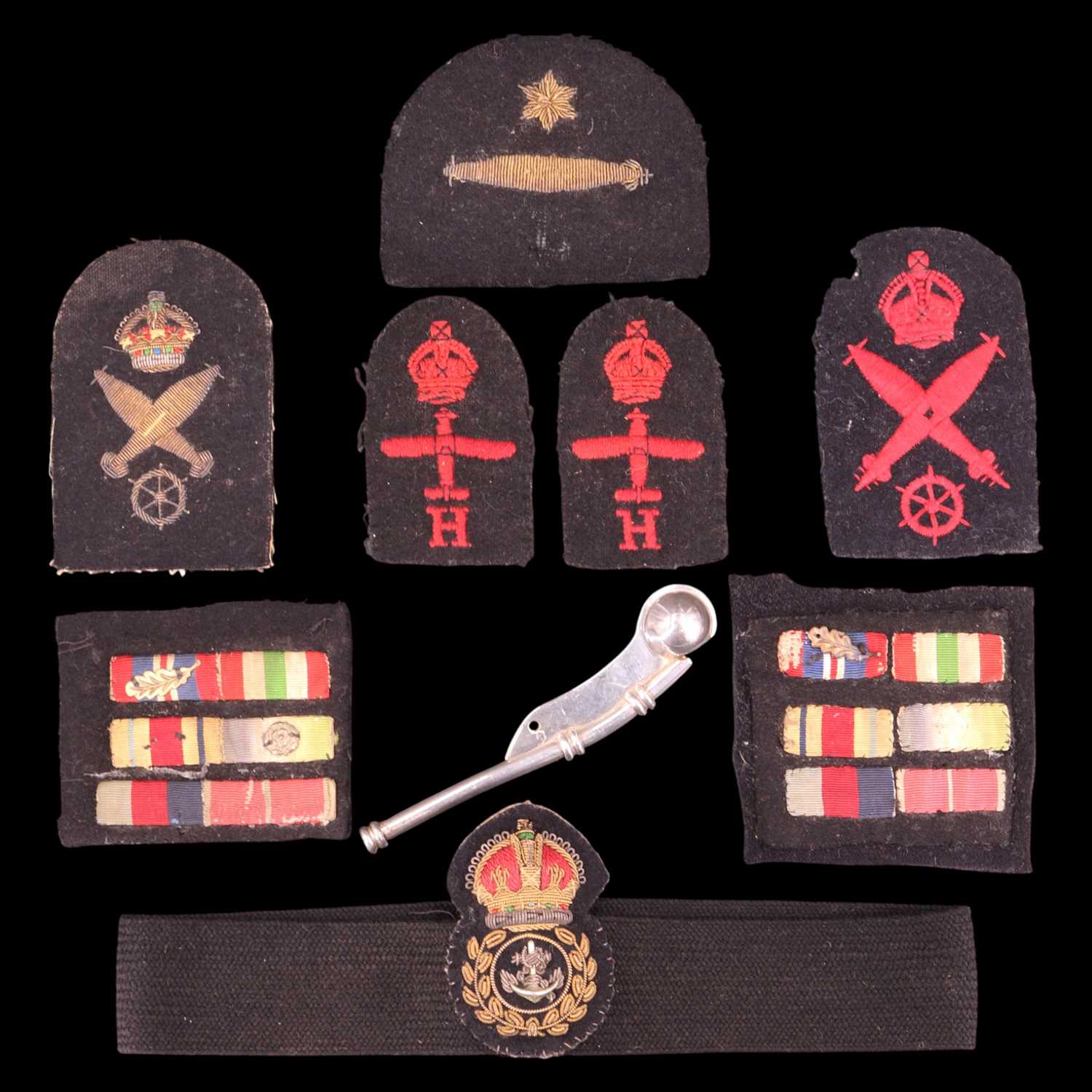 Lot 185 - A group of Royal Navy rank and trade badges,